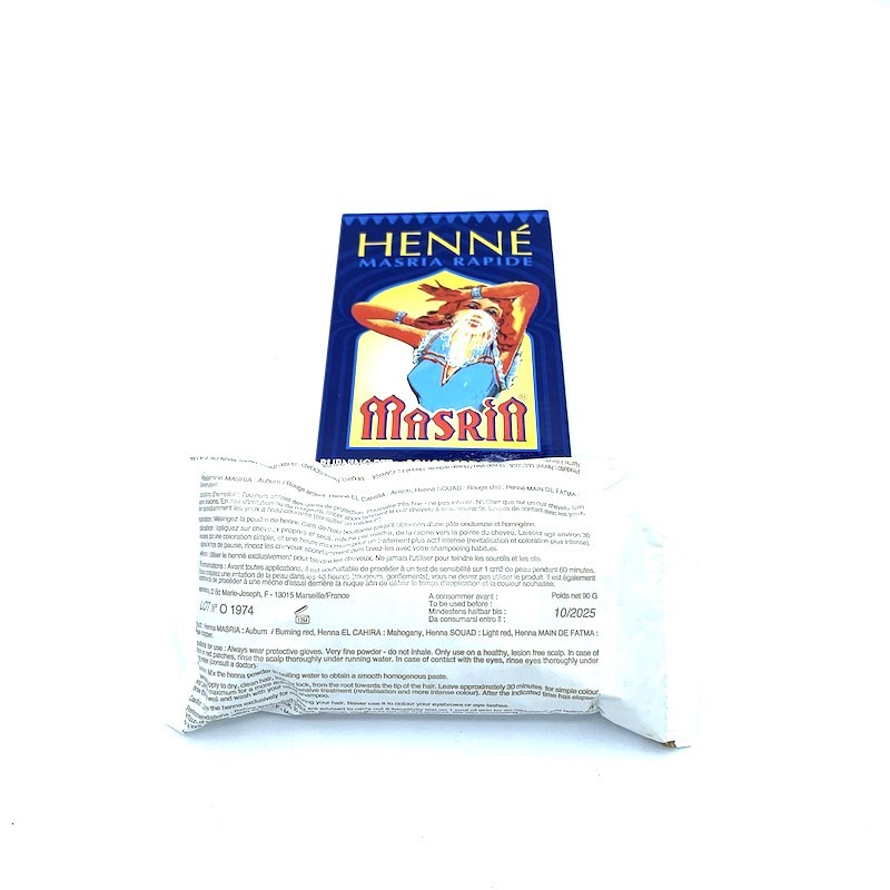 Box of fiery red henna powder for natural coloring.